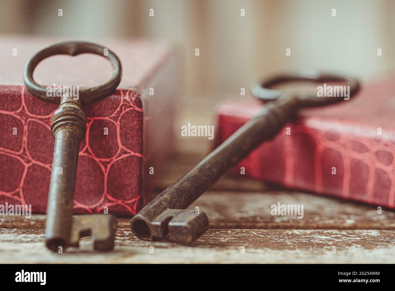 Two old keys on a table Stock Photo - Alamy