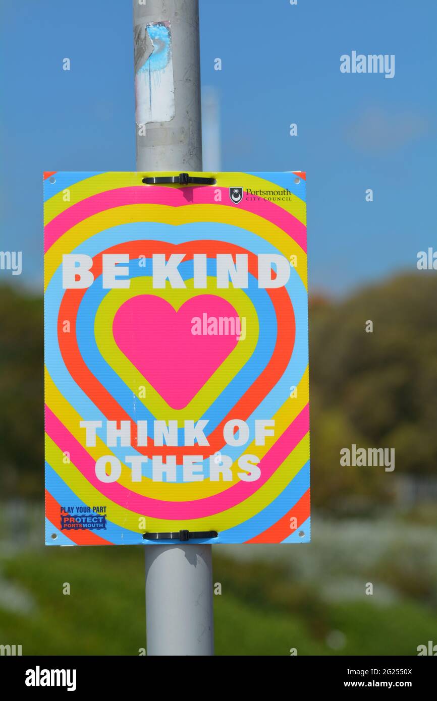 Bright coloured sign asking people to be kind and think of others ...
