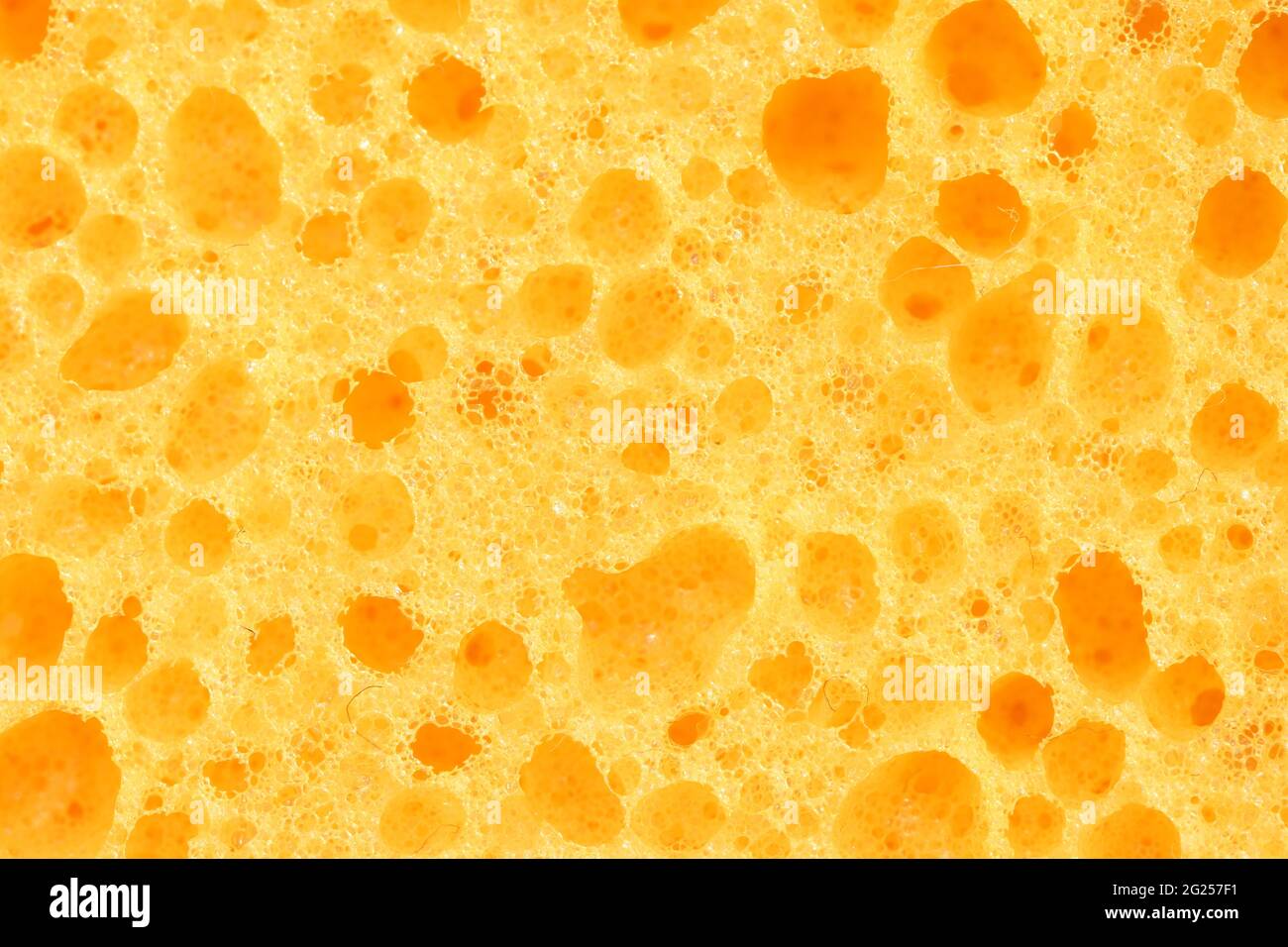 Yellow sponge texture background Stock Photo - Alamy