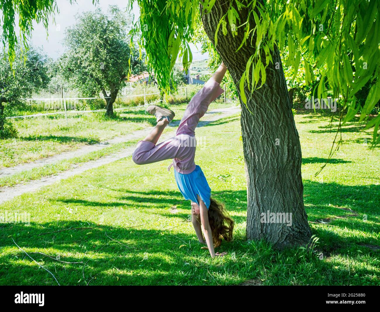 Girl doing handstand hi-res stock photography and images - Alamy