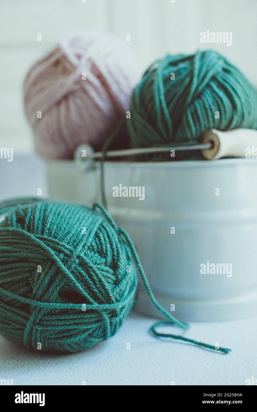 Balls of wool in a metal bucket Stock Photo - Alamy