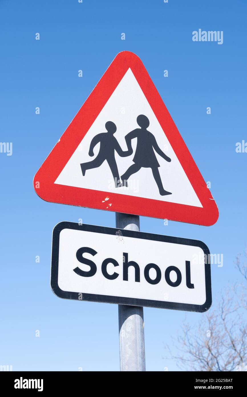 Red triangular warning sign outside school in Moreton Wirral May 2021 ...