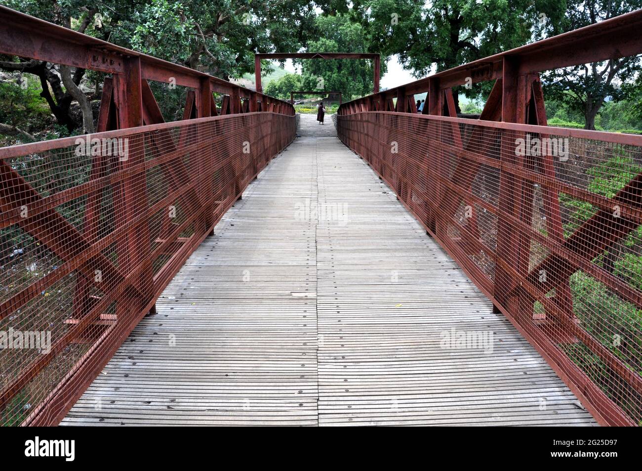 Natural view of a footbridge with red painted metal frames Stock Photo ...