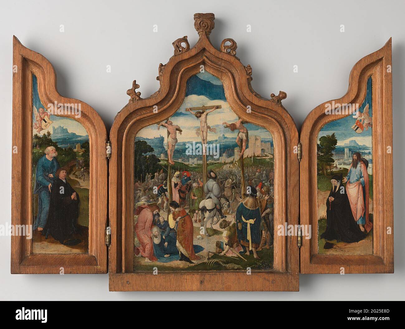 Triptych. Depicted at the centre of this triptych is The Crucifixion. On the wings Saint Peter ...