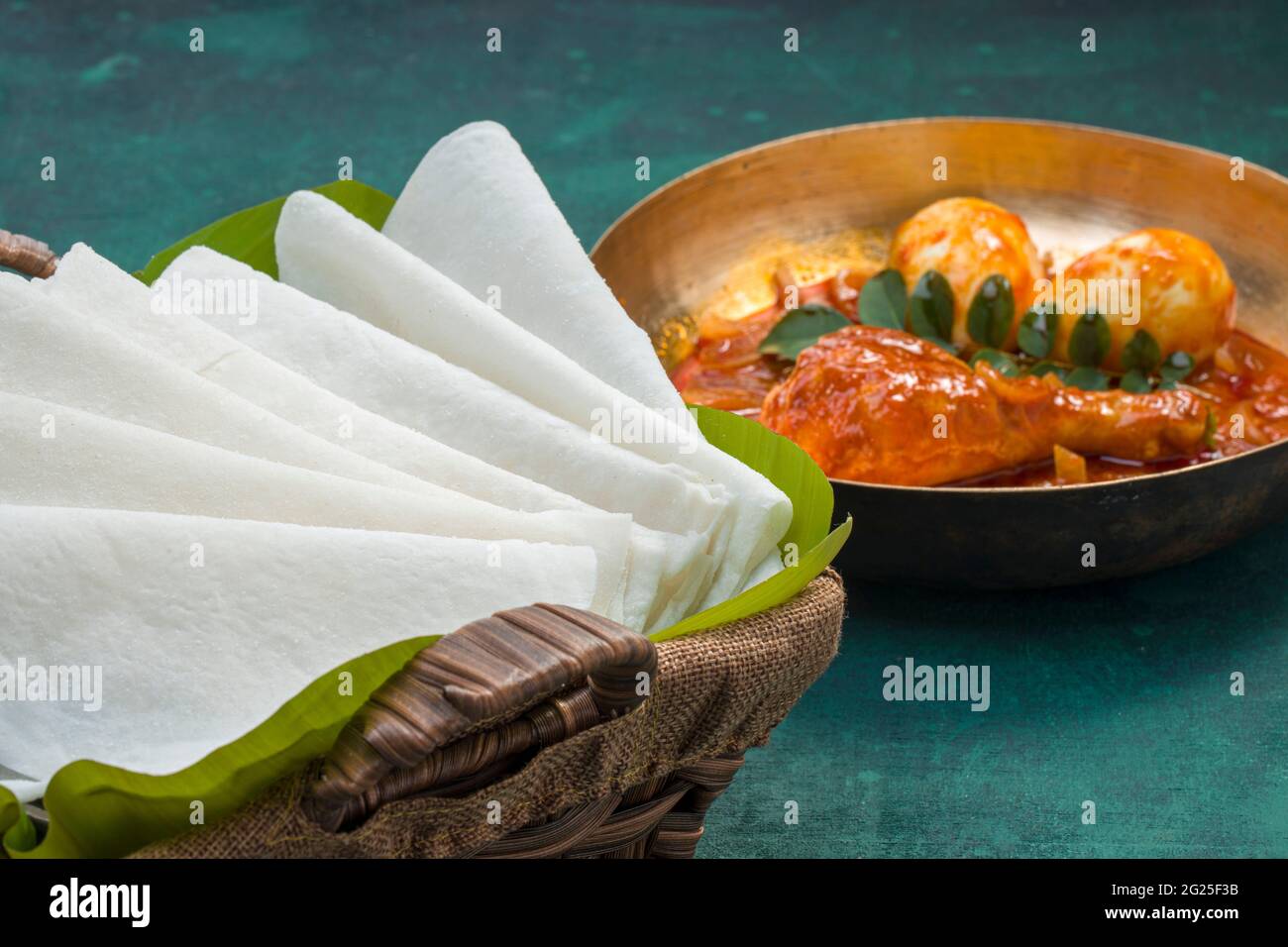 Nice Pathiri with chicken curry , malabar special food made using rice ...