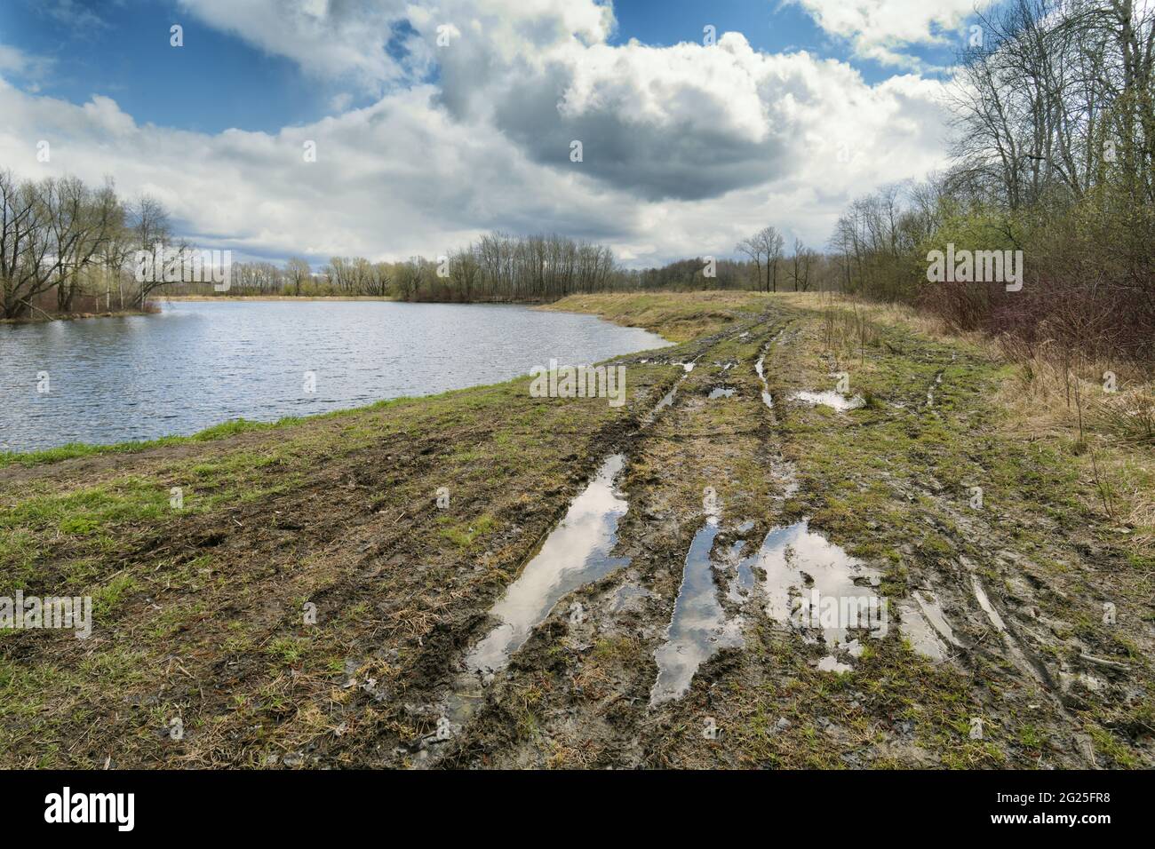 Spring slush and off-road.After the rain, there is mud and puddles on ...