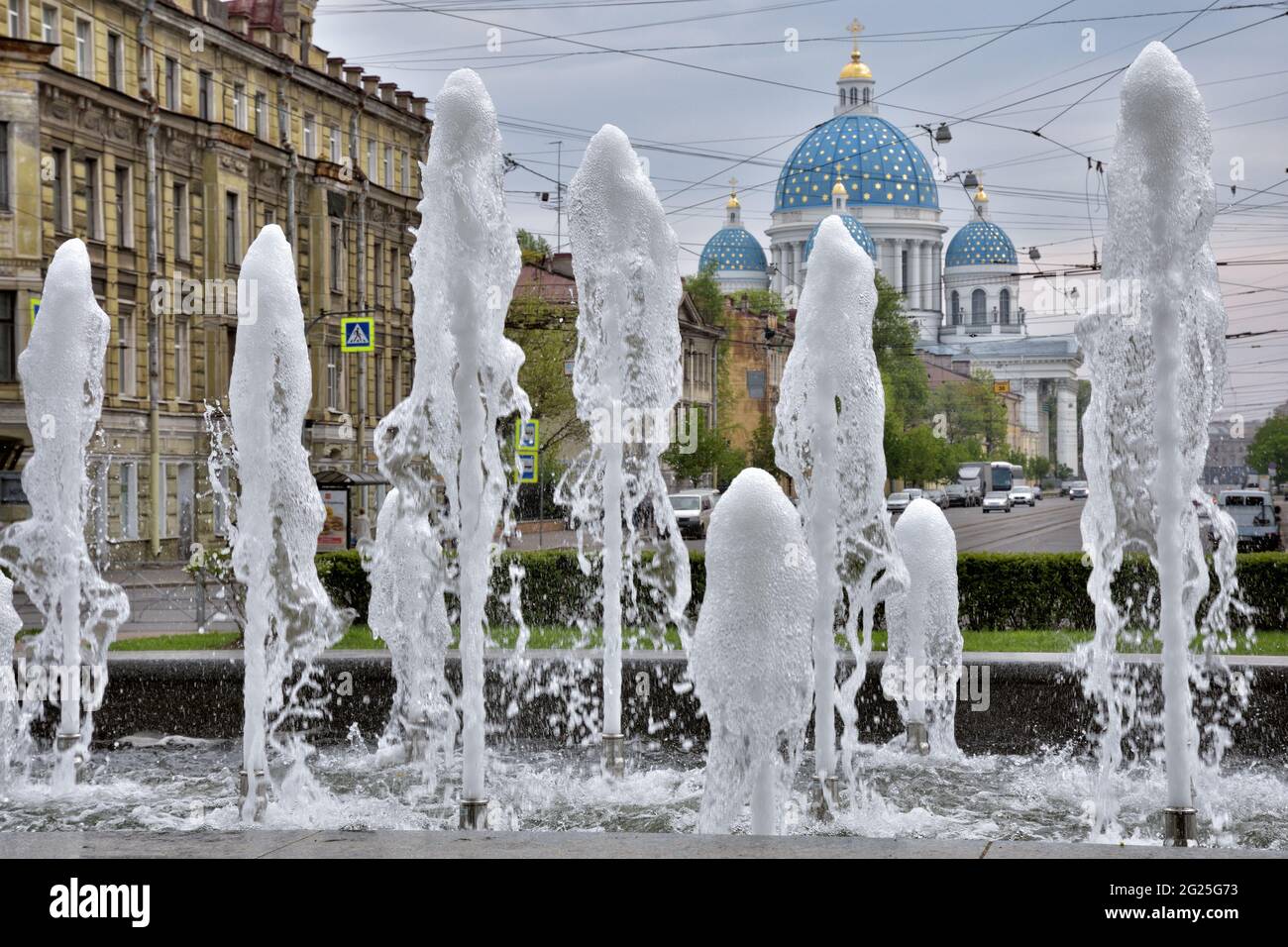 In the summer, fountains are turned on in the city.It is cool around ...