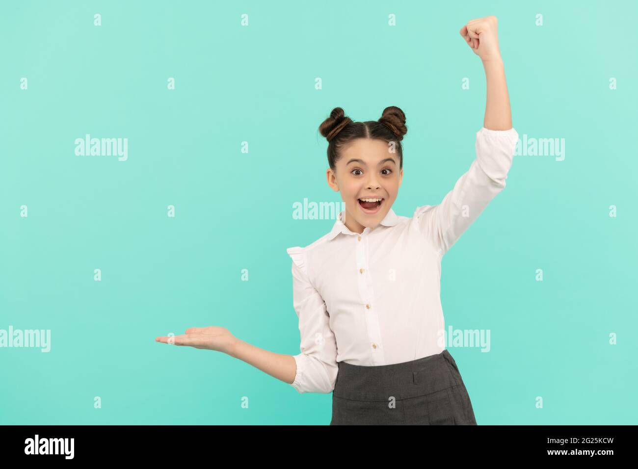 Happy girl give winning gesture showing open hand presenting product ...