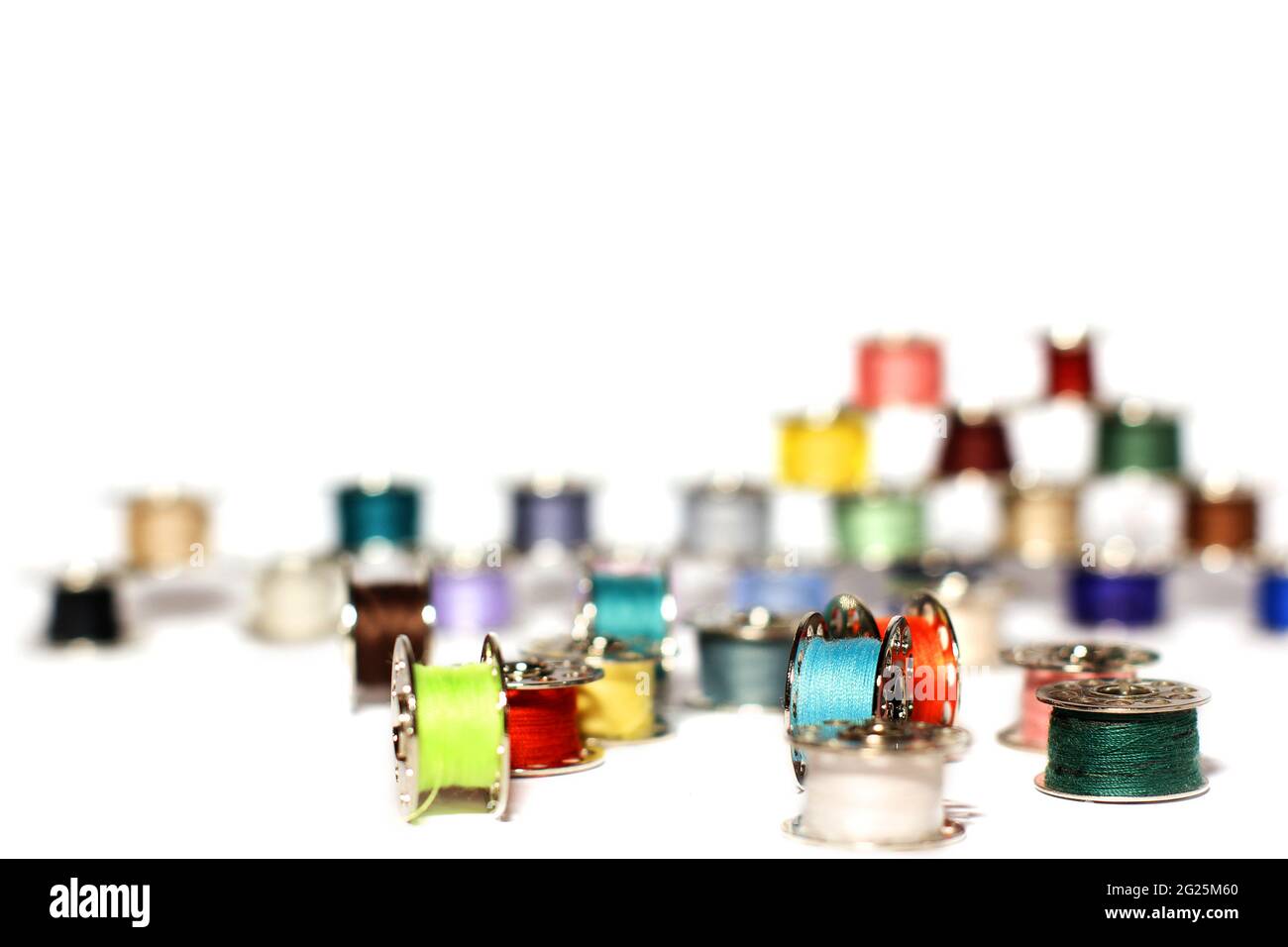 Spools of thread on a white background. For sewing Stock Photo - Alamy