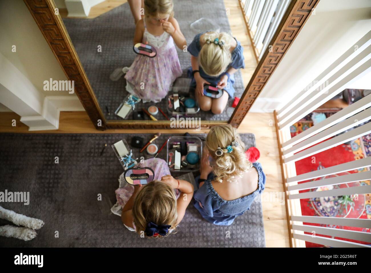 overhead view of little girls putting on makeup in the mirror Stock ...