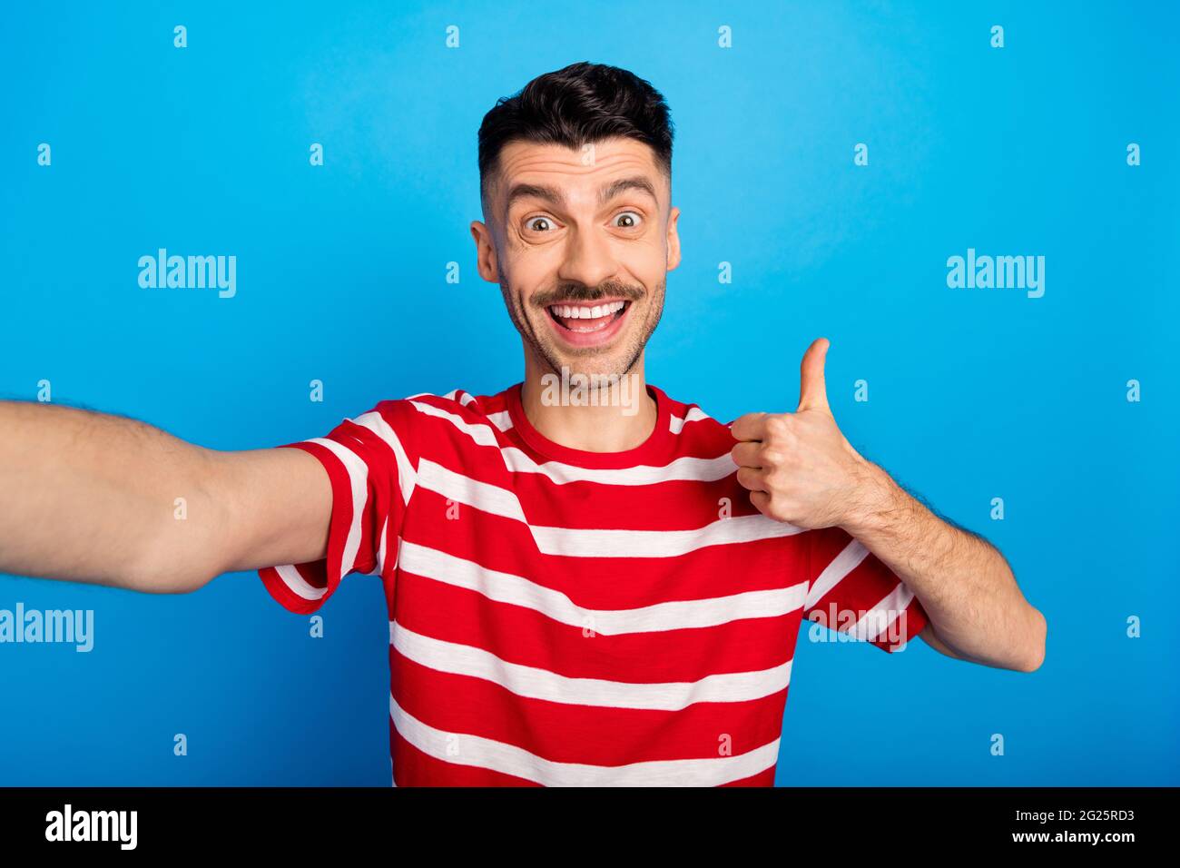 Photo of excited happy young man make thumb-up recommend promoter make ...