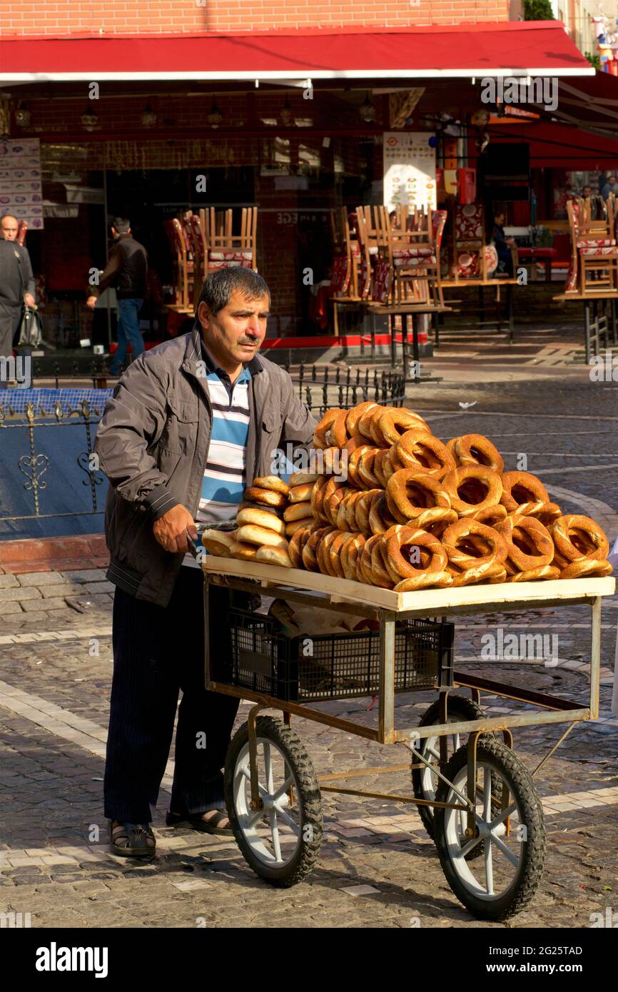 Turkish breadseller transporting his produce on a cart, Sultanahmet ...
