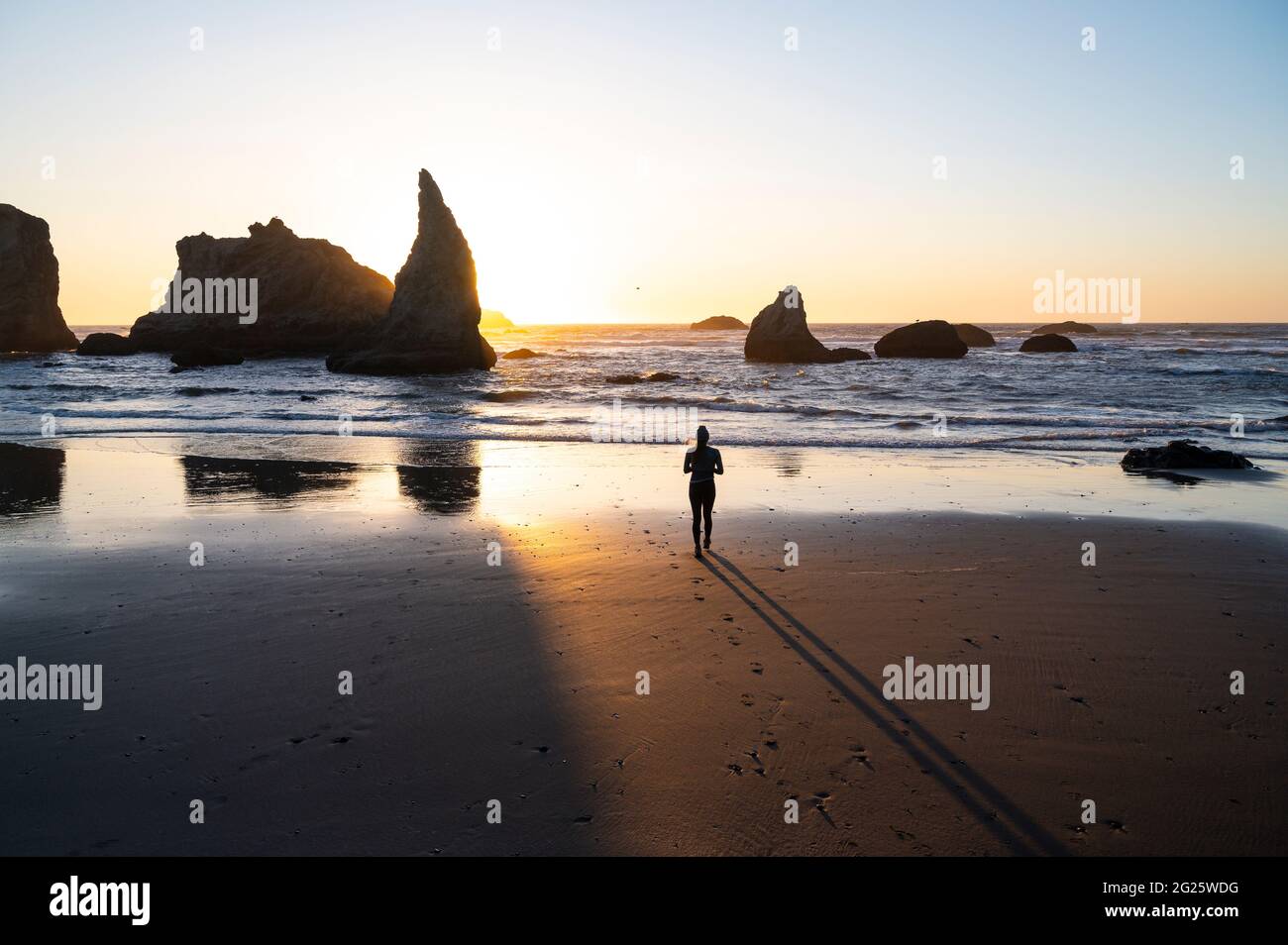 Sun Setting Behind Sea Stacks On The Oregon Coast Stock Photo - Alamy