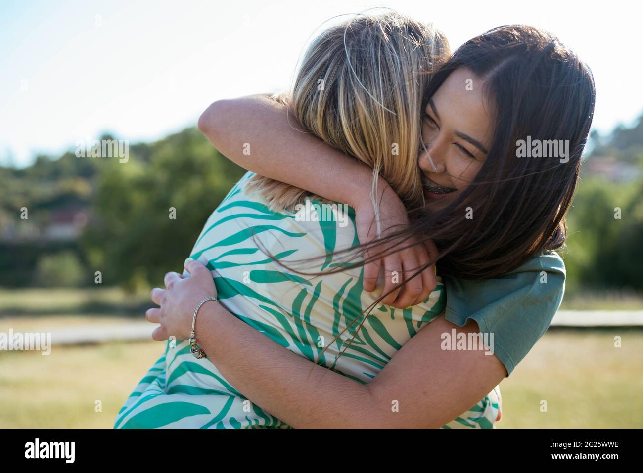 Happy women hugging each other hi-res stock photography and images - Alamy