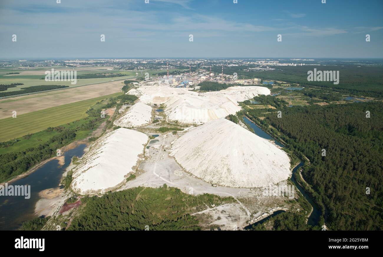 Pile of factory waste in green area aerial drone view Stock Photo - Alamy