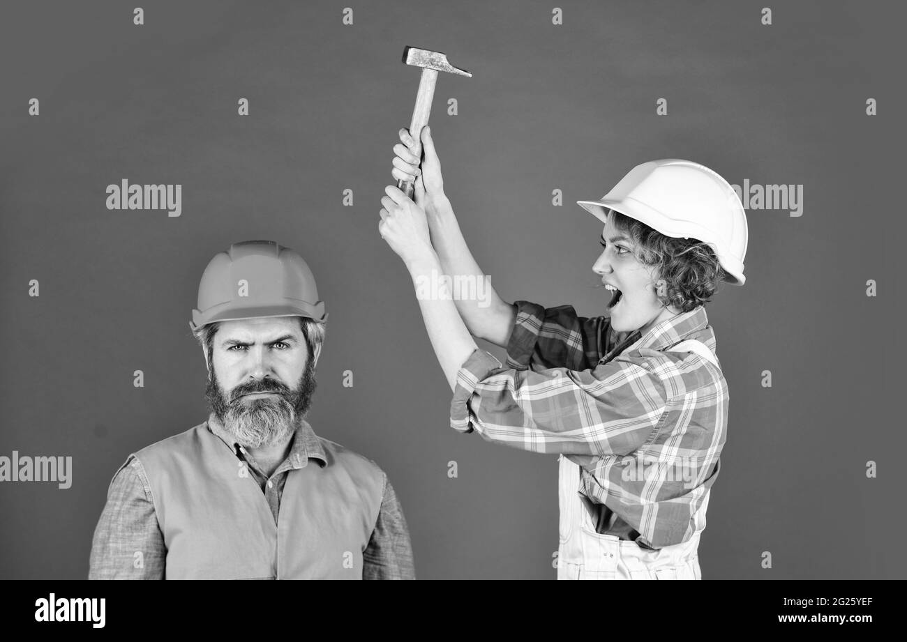 Couple making repair at home. Home Renovation. Rub in. Couple knocking ...