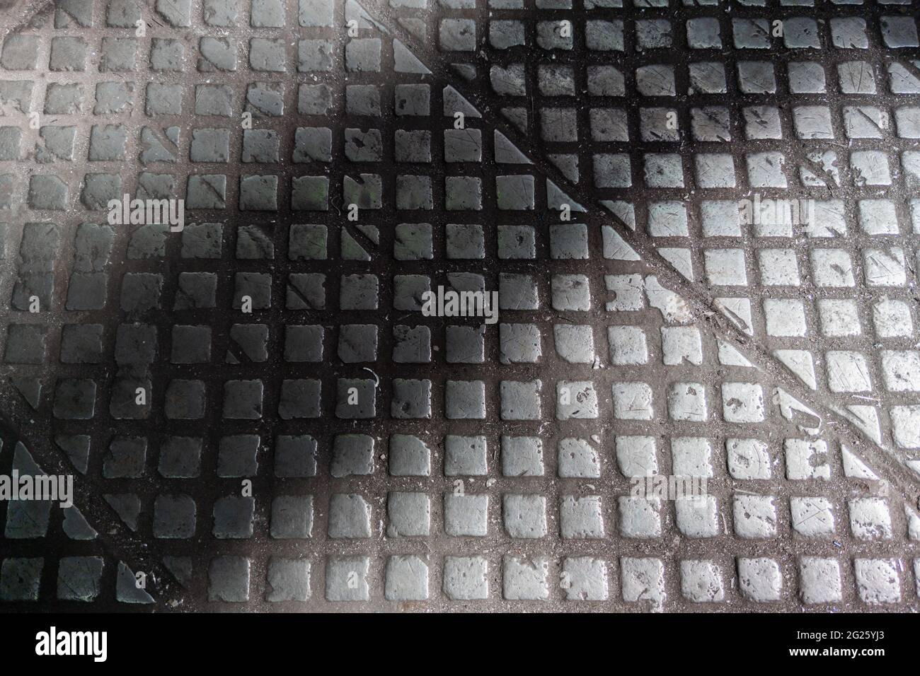 old cast iron industrial floor tiles with checkered skid-proof pattern ...