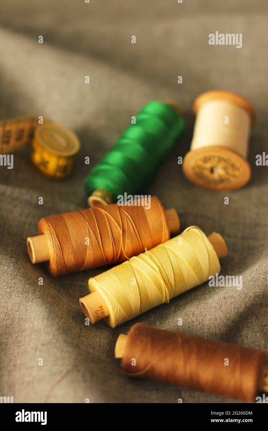 Sewing. Spools of thread on the fabric. Threads. Meter Stock Photo - Alamy
