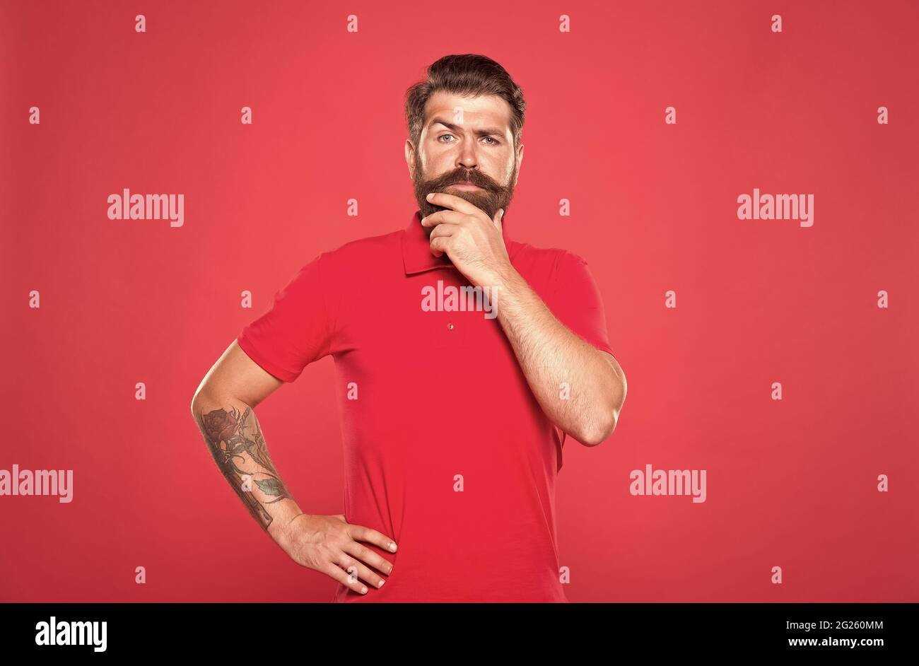 Why so serious. Serious look of brutal hipster. Bearded man think red ...