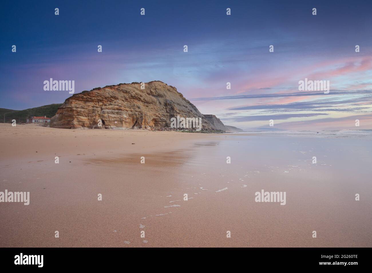Beautiful sandy ocean beach and cliff at the sunset. Panorama atlantic ...