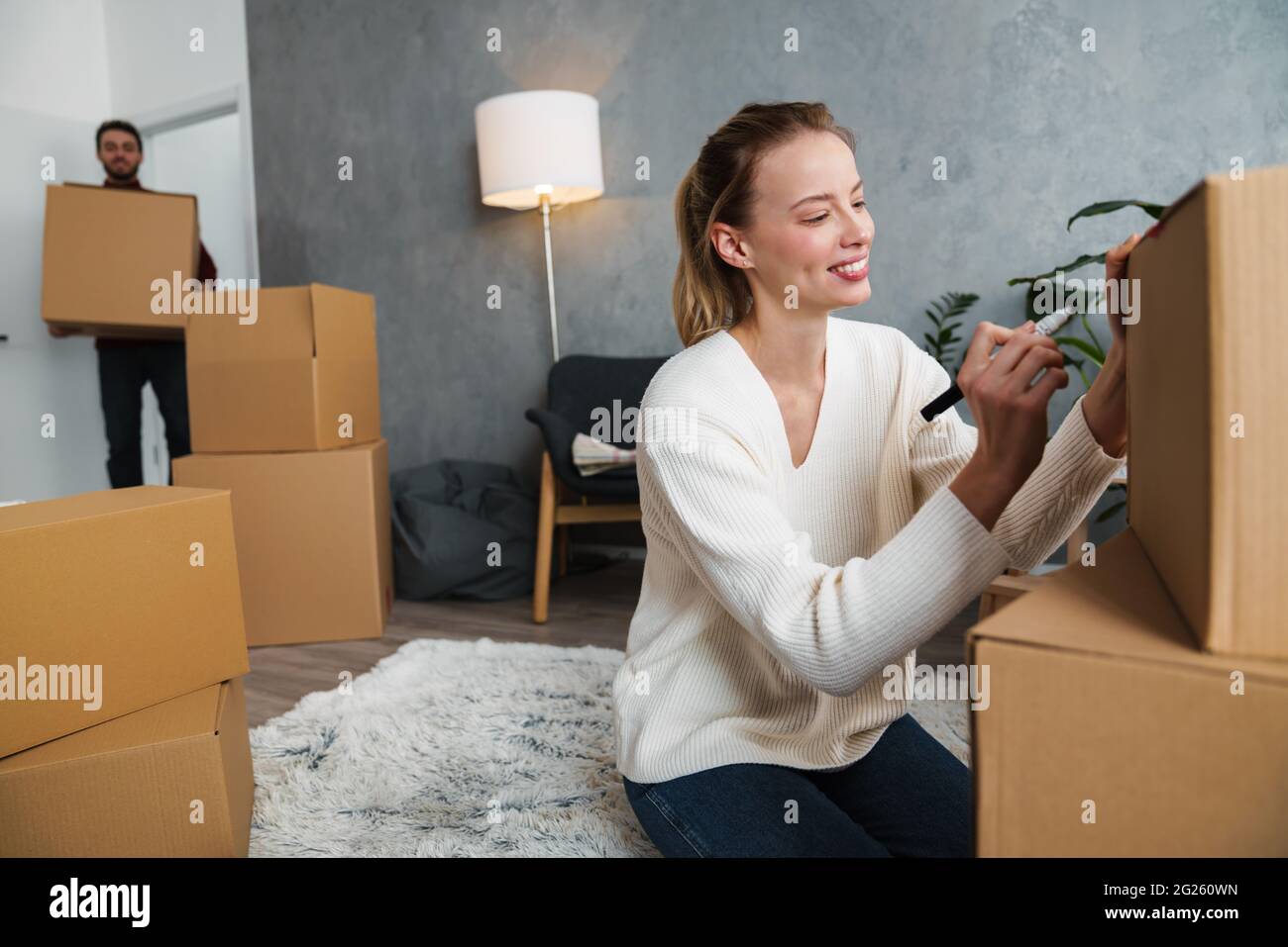 Old man packing boxes hi-res stock photography and images - Alamy