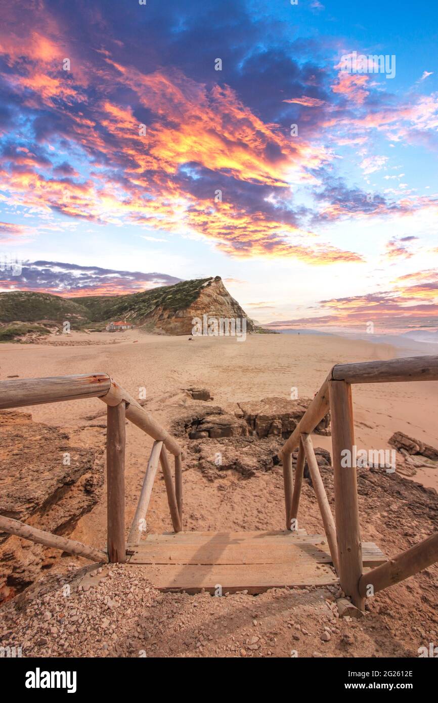Beautiful sandy ocean beach and cliff at the sunset. Panorama atlantic ...