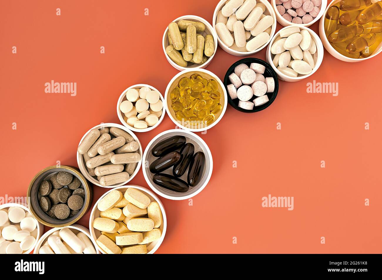 close-up of multivitamin biologically active supplements on coral ...
