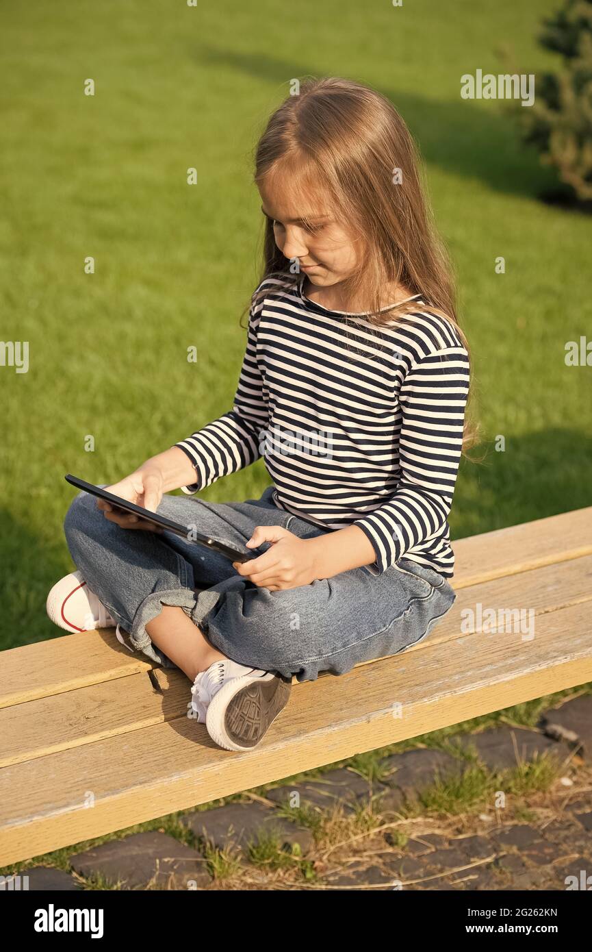 Experience changing the way you learn and play. Small child use tablet ...