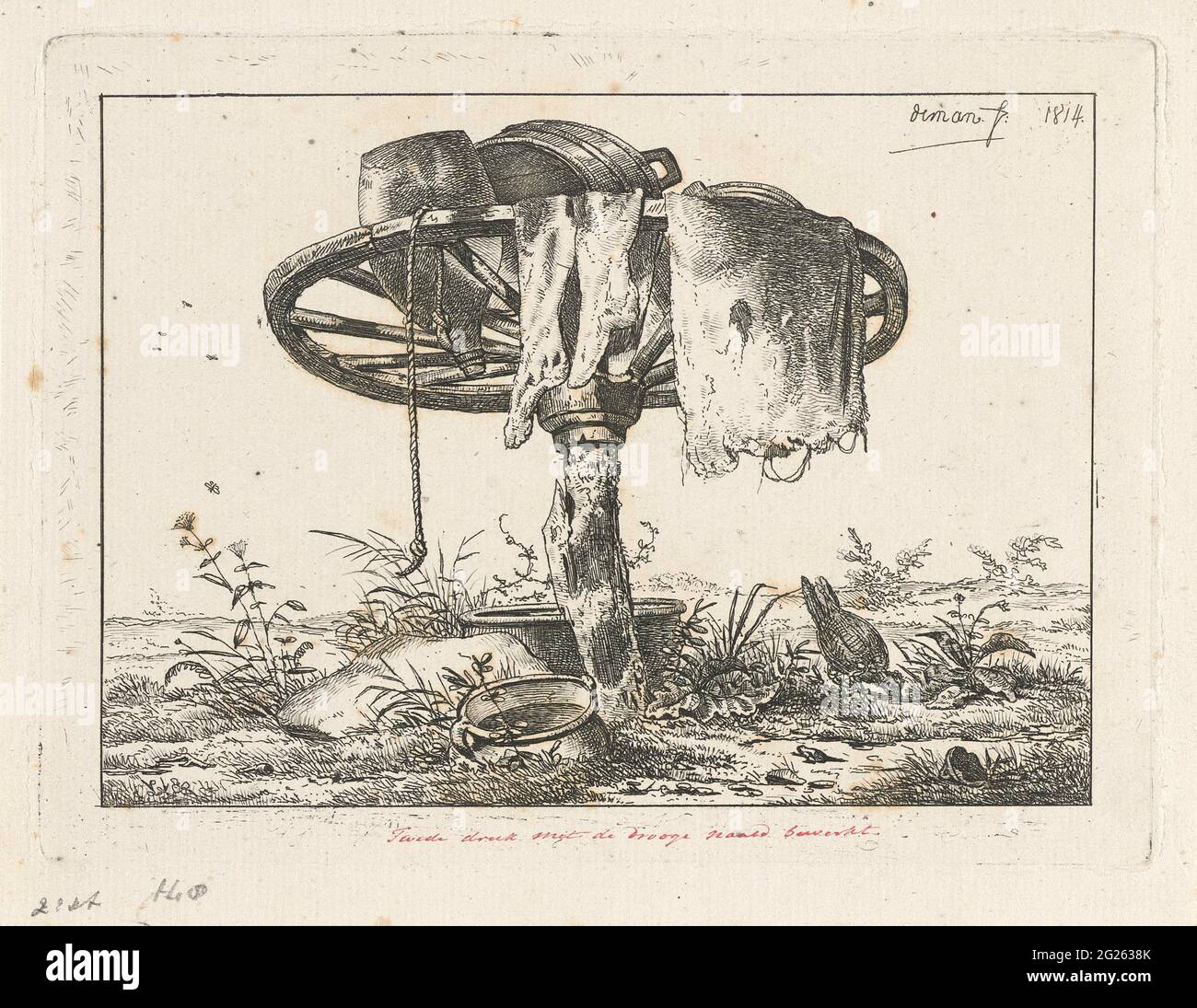 Wheel on a pole. A wagon wheel on a tree trunk, with it's garments, a ...