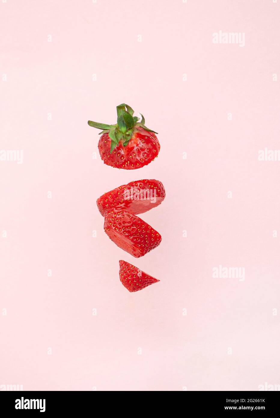 The composition of flying strawberries on pink background. Strawberry ... The composition of flying strawberries on pink background. Strawberry ...