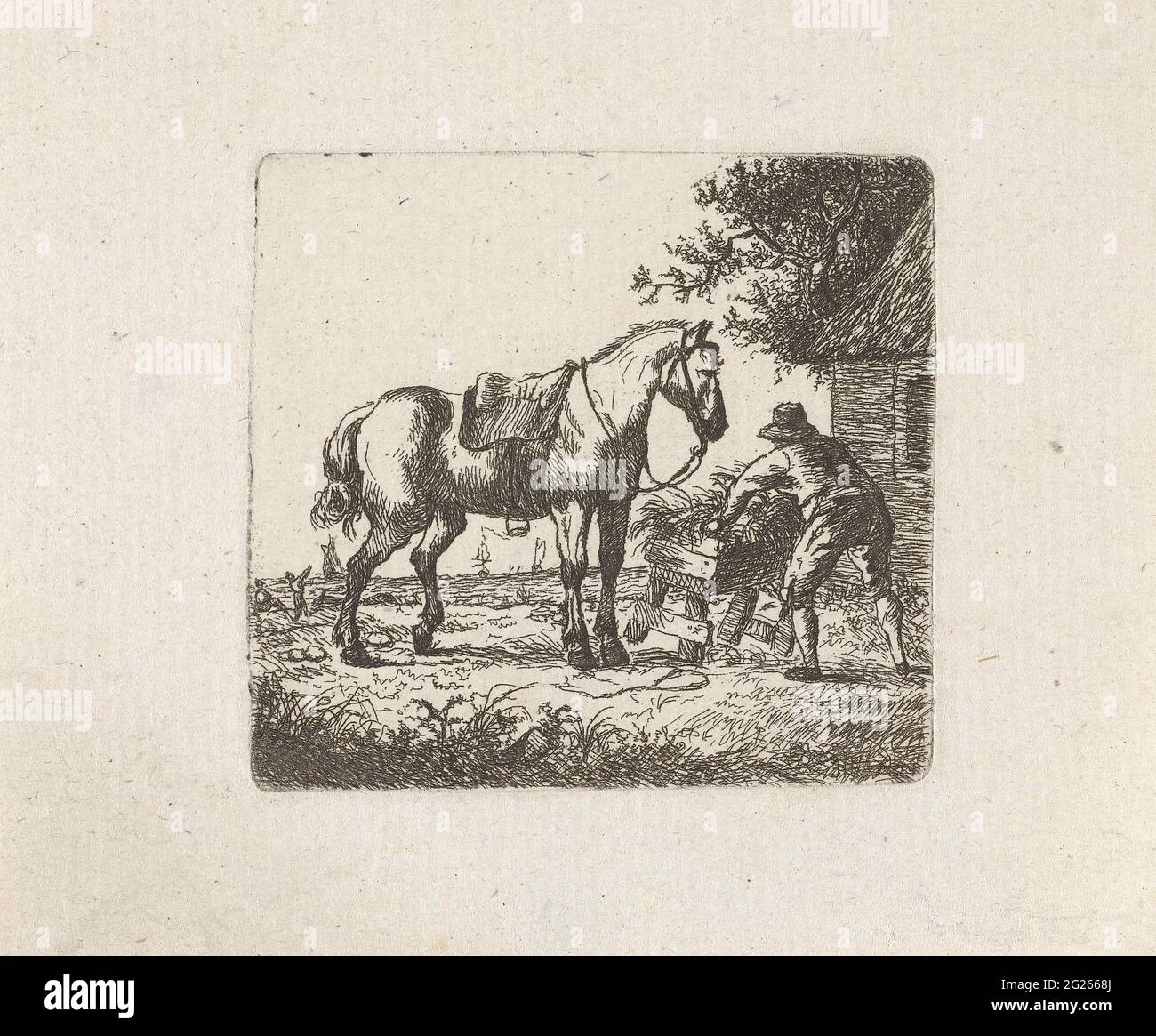 Feeding the horse. For a farm a man puts a manger with hay for a ...