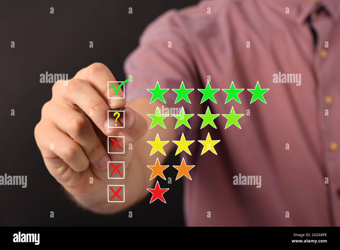 Man hand putting check mark a checkbox on five star rating on black ...