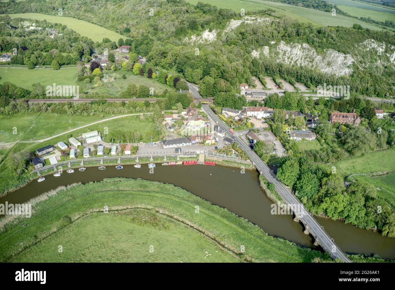 Aerial view towards Amberley with boats on the River Arun ang the road ...