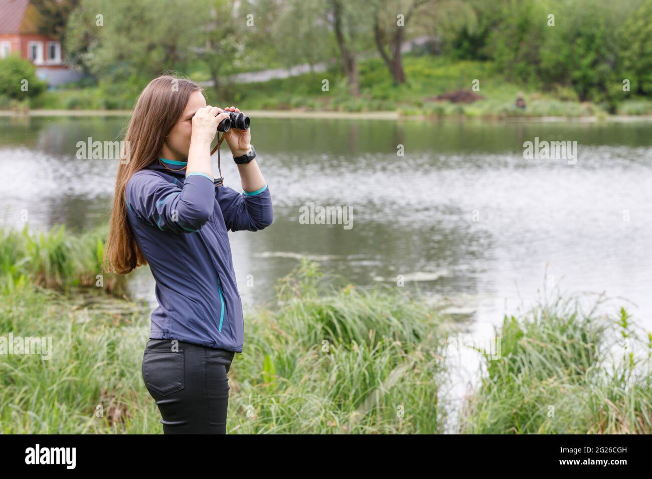 Birdwatching birdwatcher female girl woman hi-res stock photography and ...