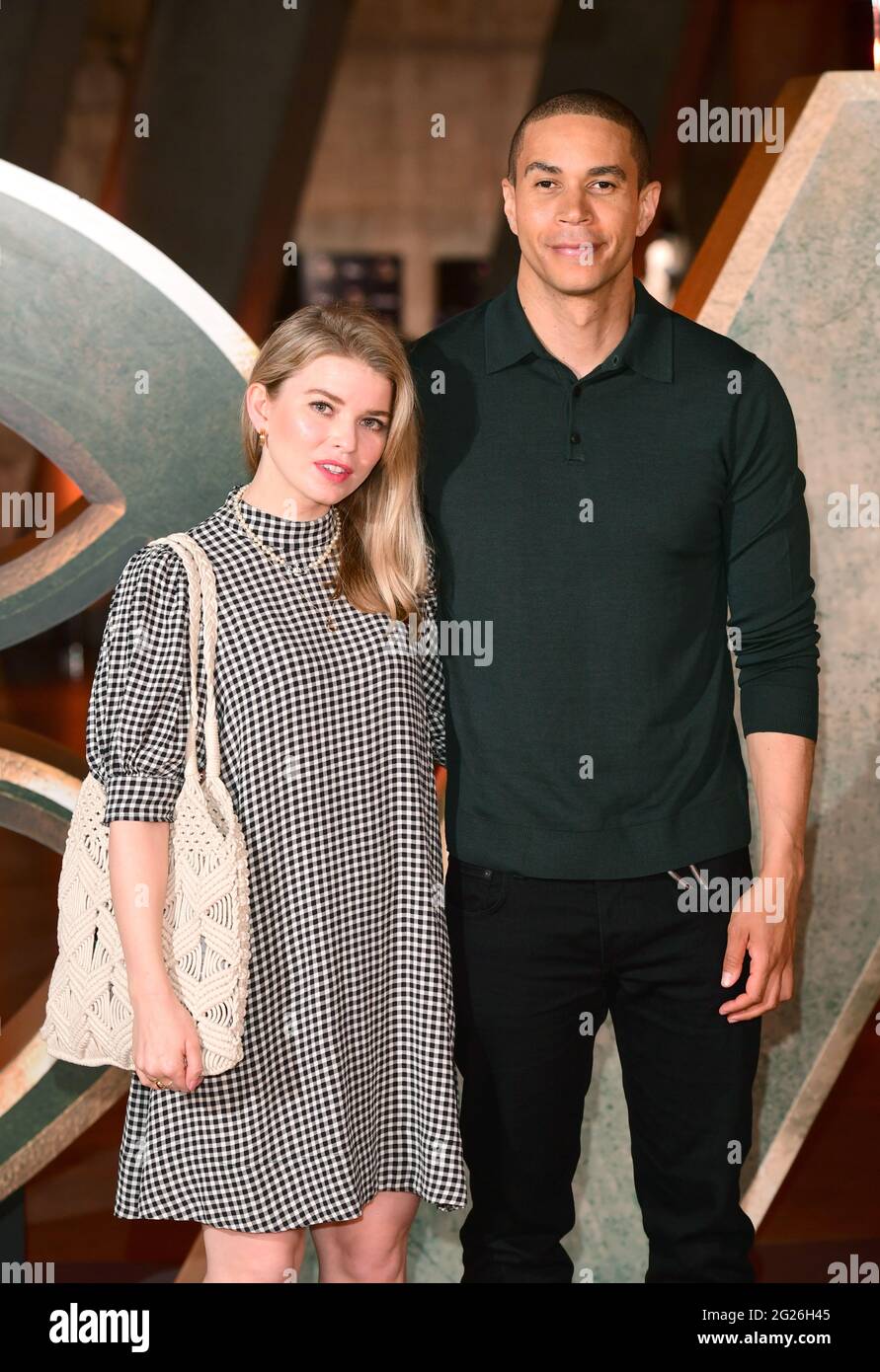 John Macmillan (R) and guest attend a photocall for Disney's Loki in ...