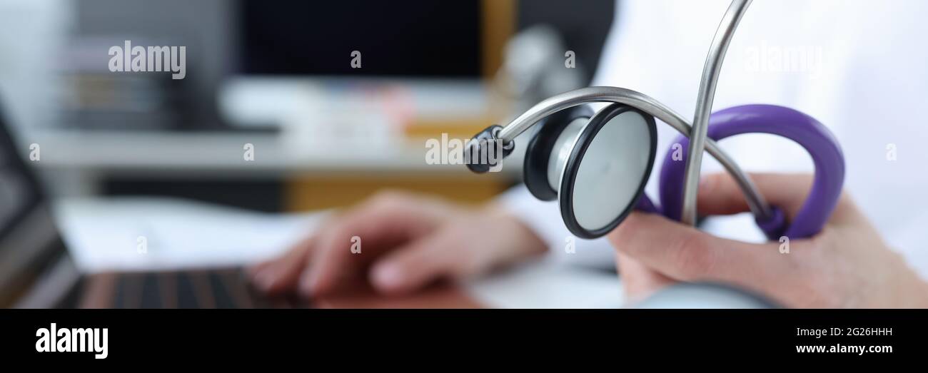 Doctor typing treatment on laptop hi-res stock photography and images ...
