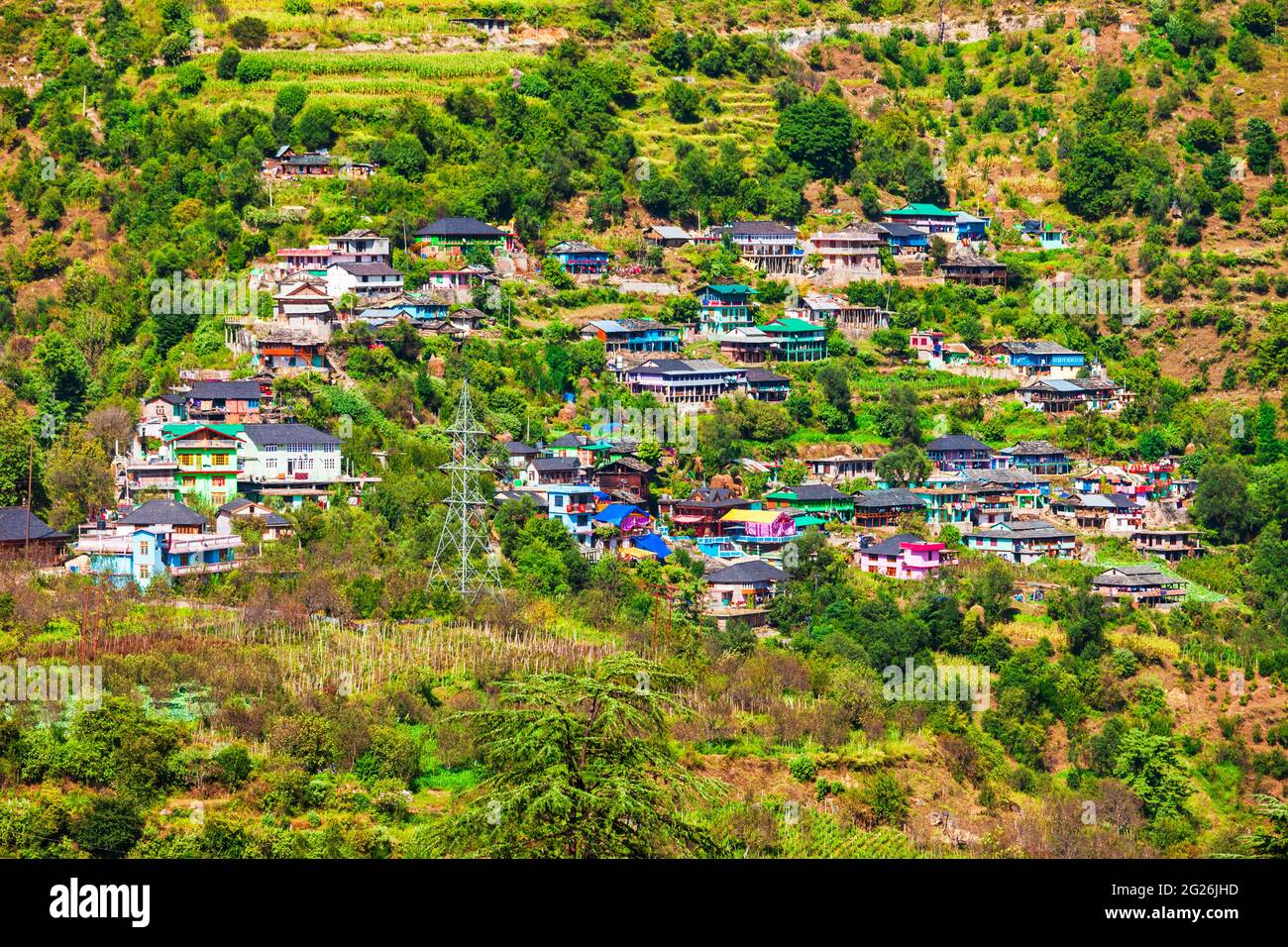 Scenic landscape of the local houses and forested Himalaya mountains in ...