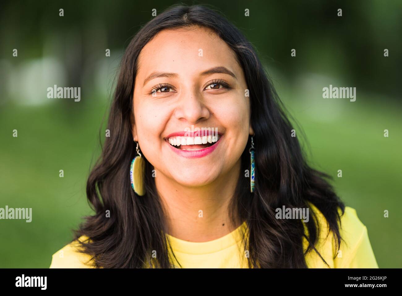 Happy latin young woman headshot with smile expression background with ...