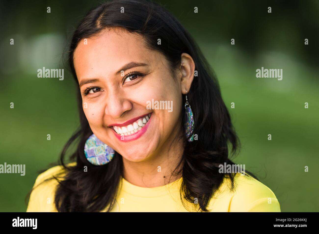 Happy latin young woman headshot with smile expression background with ...