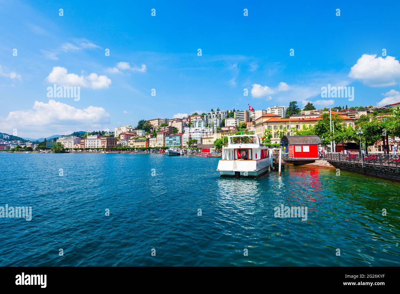 Tourist boat in Lugano lake and Lugano city in canton of Ticino in ...