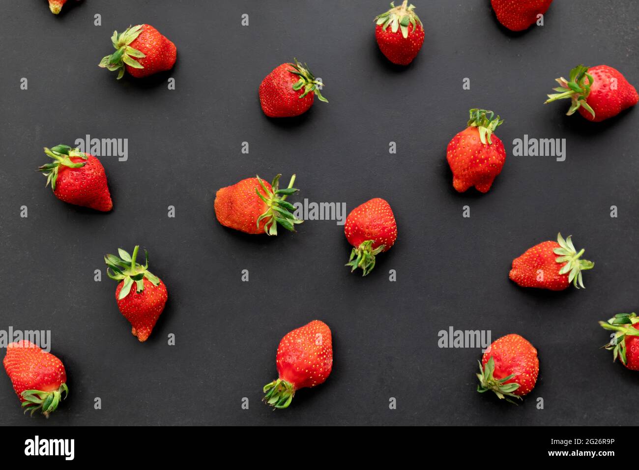 Ripe strawberries on black background, summer berry, top view Stock ...