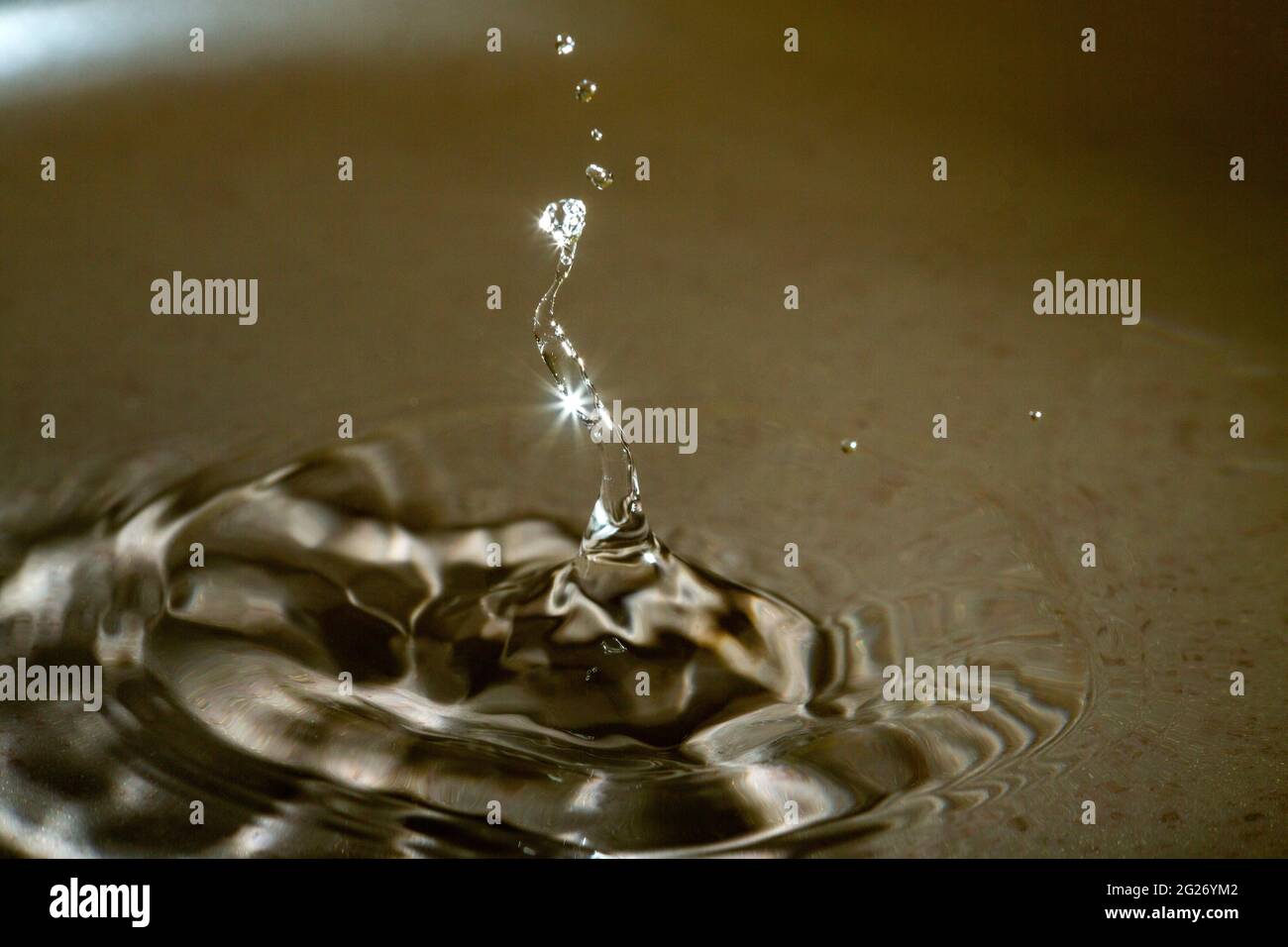 Clear water drop on a grey environment Stock Photo - Alamy