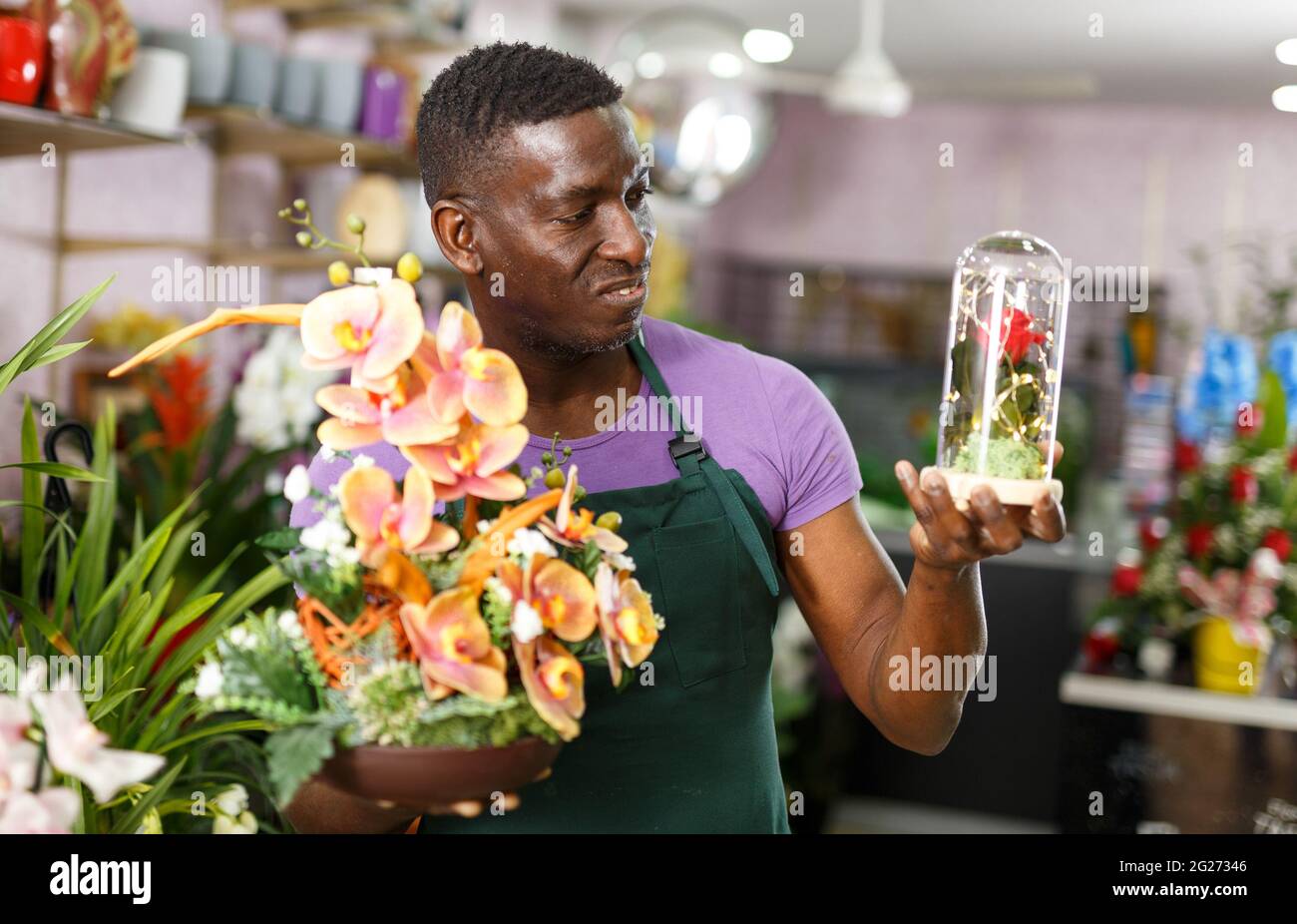 Man working in flower shop Stock Photo - Alamy