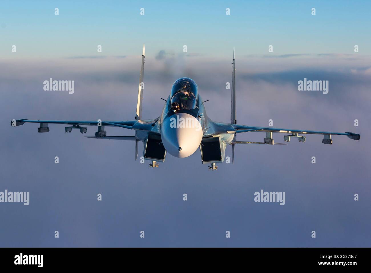 Su-30SM jet fighter of the Russian Navy flying in mid-air behind a ...