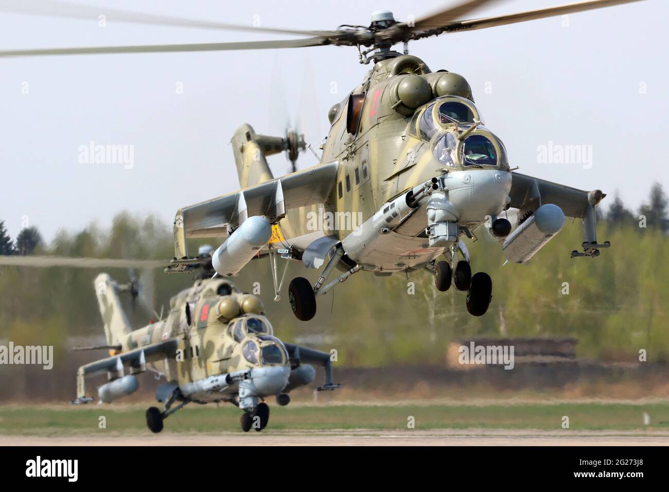 Mil Mi-24P attack helicopters of the Russian Air Force departing for a parade rehearsal Stock ...
