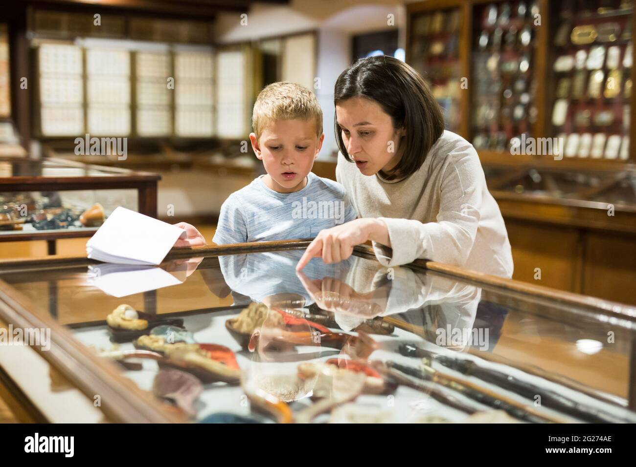 Woman and boy exploring artworks in museum Stock Photo - Alamy