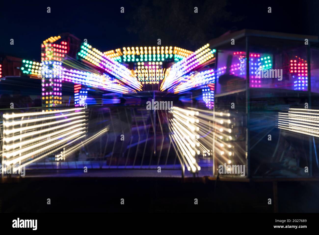 Long exposure zoom of carnival ride lights abstract background Stock ...