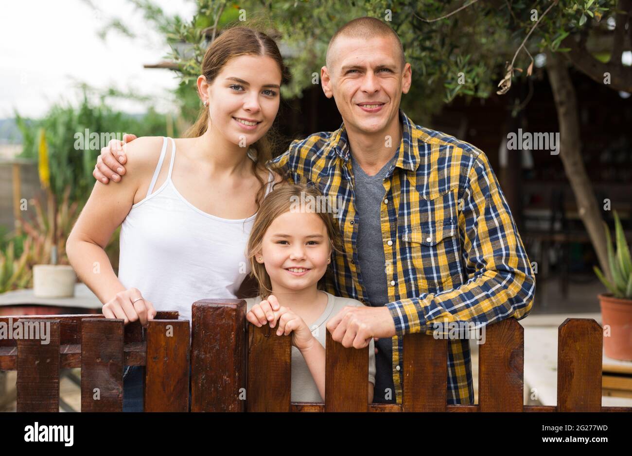 Portrait of friendly family in the courtyard of country house Stock ...