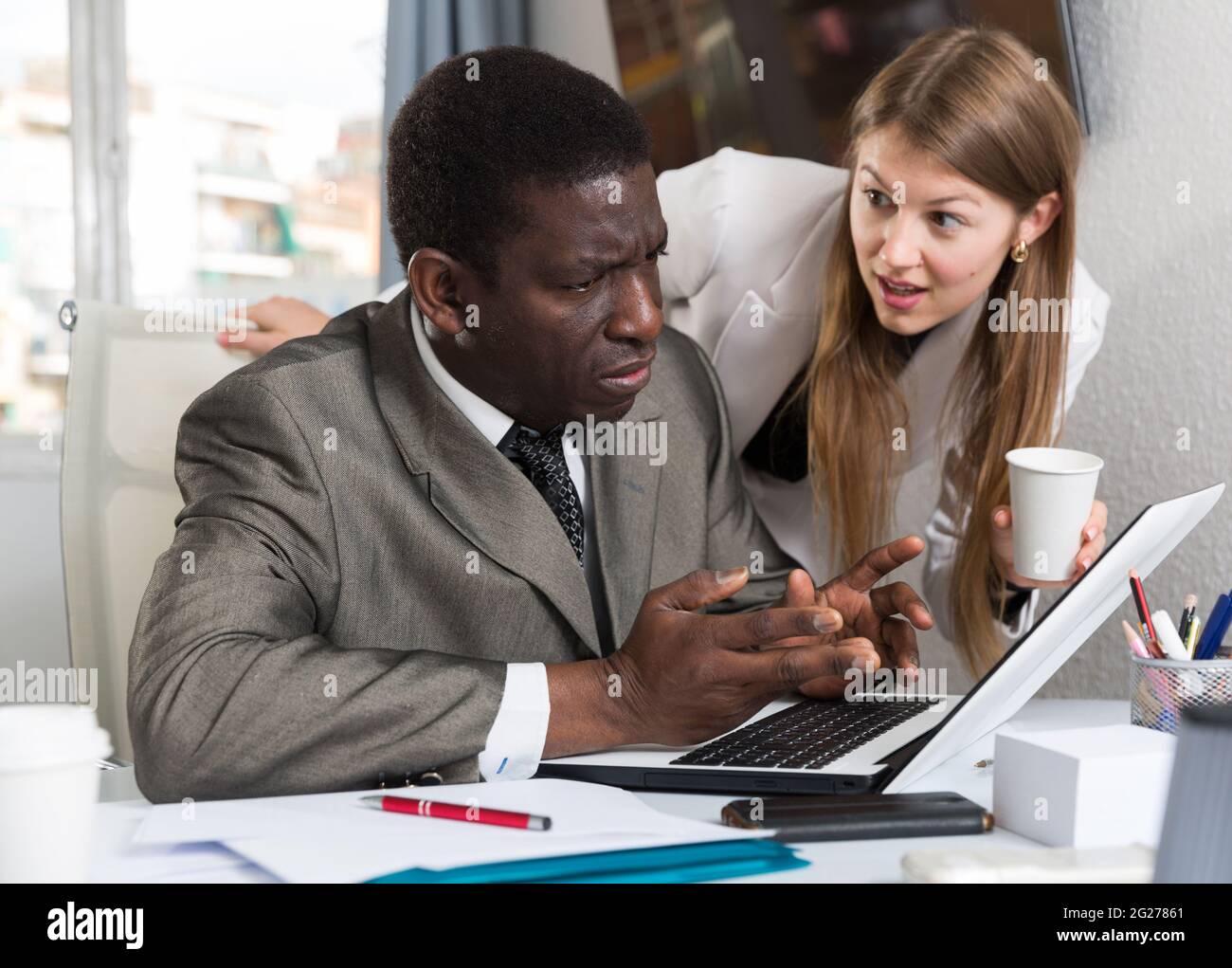 Male manager helping colleagues project hi-res stock photography and ...