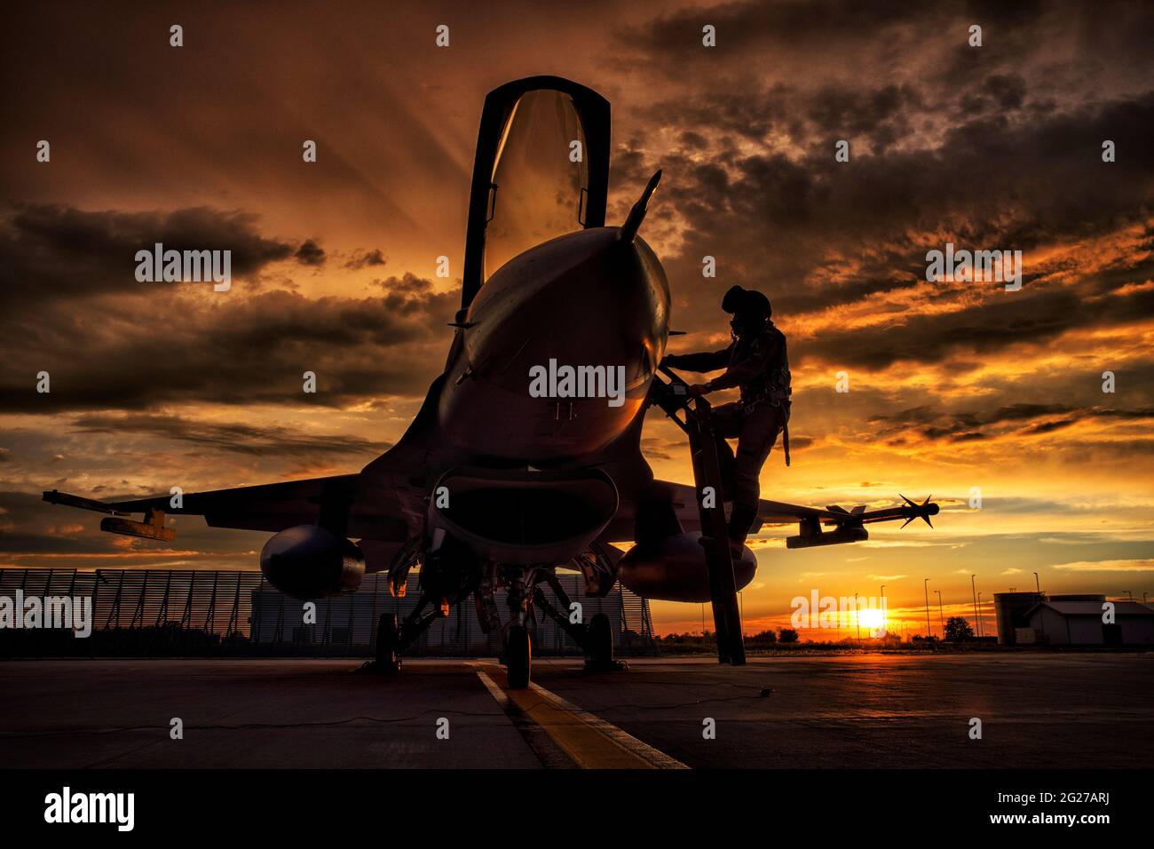 Pilot climbing into the cockpit of a Romanian Air Force F-16AM Fighting ...